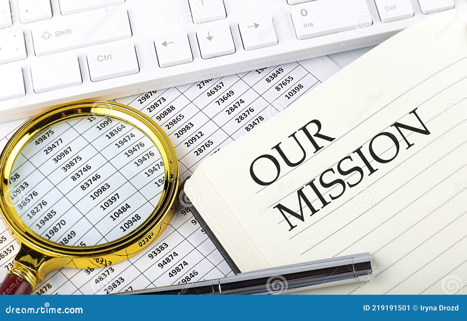 OUR MISSION Text on Notebook with Chart, Magnifier,keyboard and Pen ...