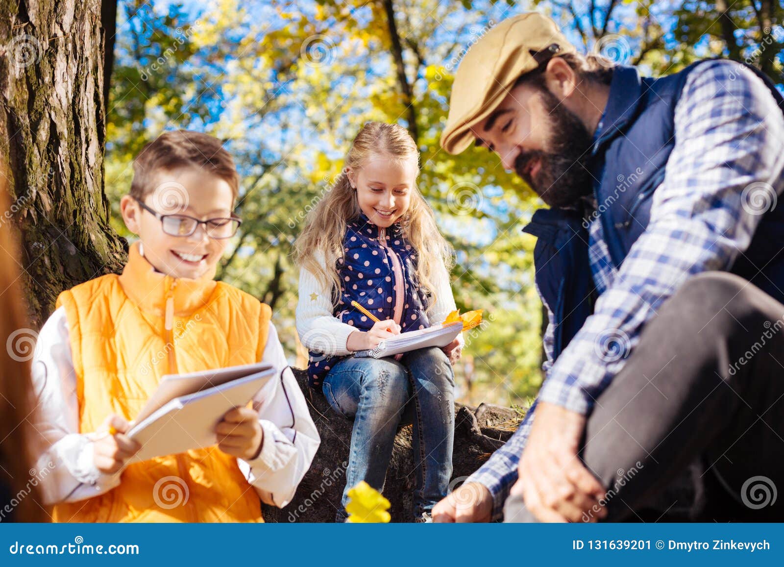 Joyful Nice Children Looking into Their Notes Stock Image - Image of ...
