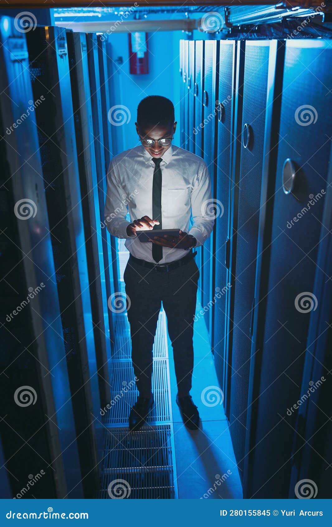 Our Systems Need a Bit of a Boost. Full Length Shot of a Young it Specialist Standing Alone in ...