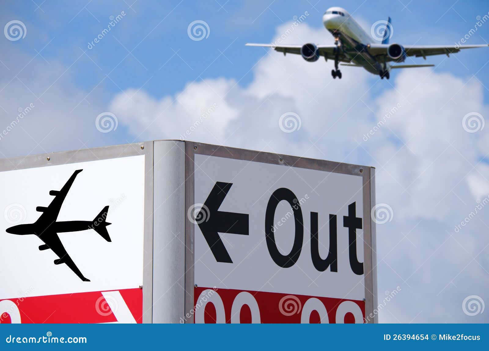Out Directional Sign at Airport with Plane in Back Stock Photo - Image ...