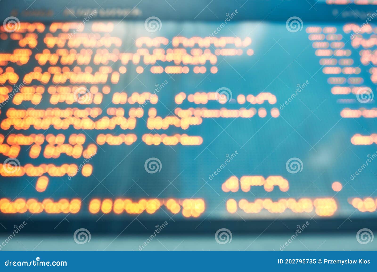 Out of Focus Blurred Display Screen with Orange Digital Characters and ...