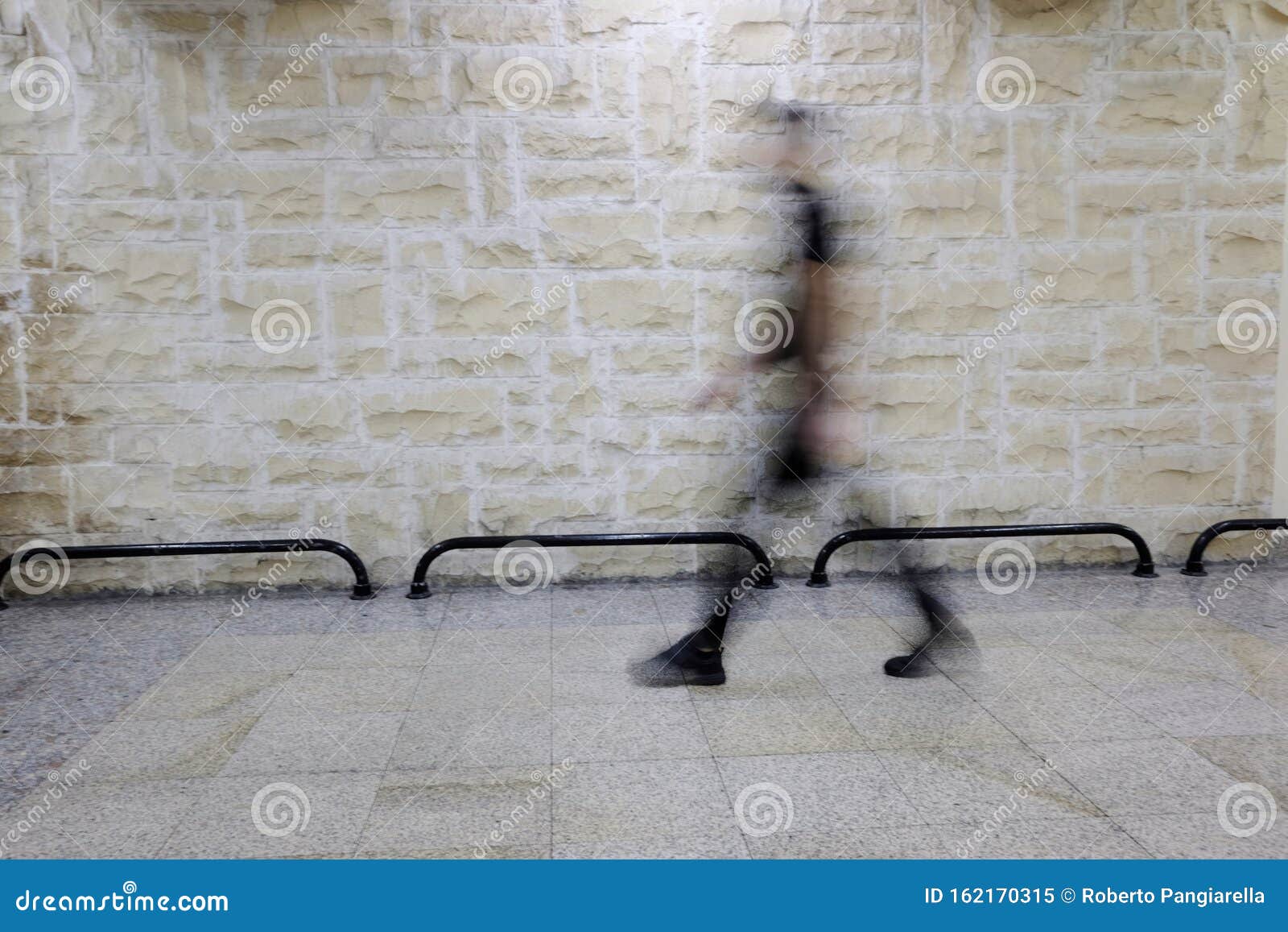 Out of focus man walking stock image. Image of passage - 162170315