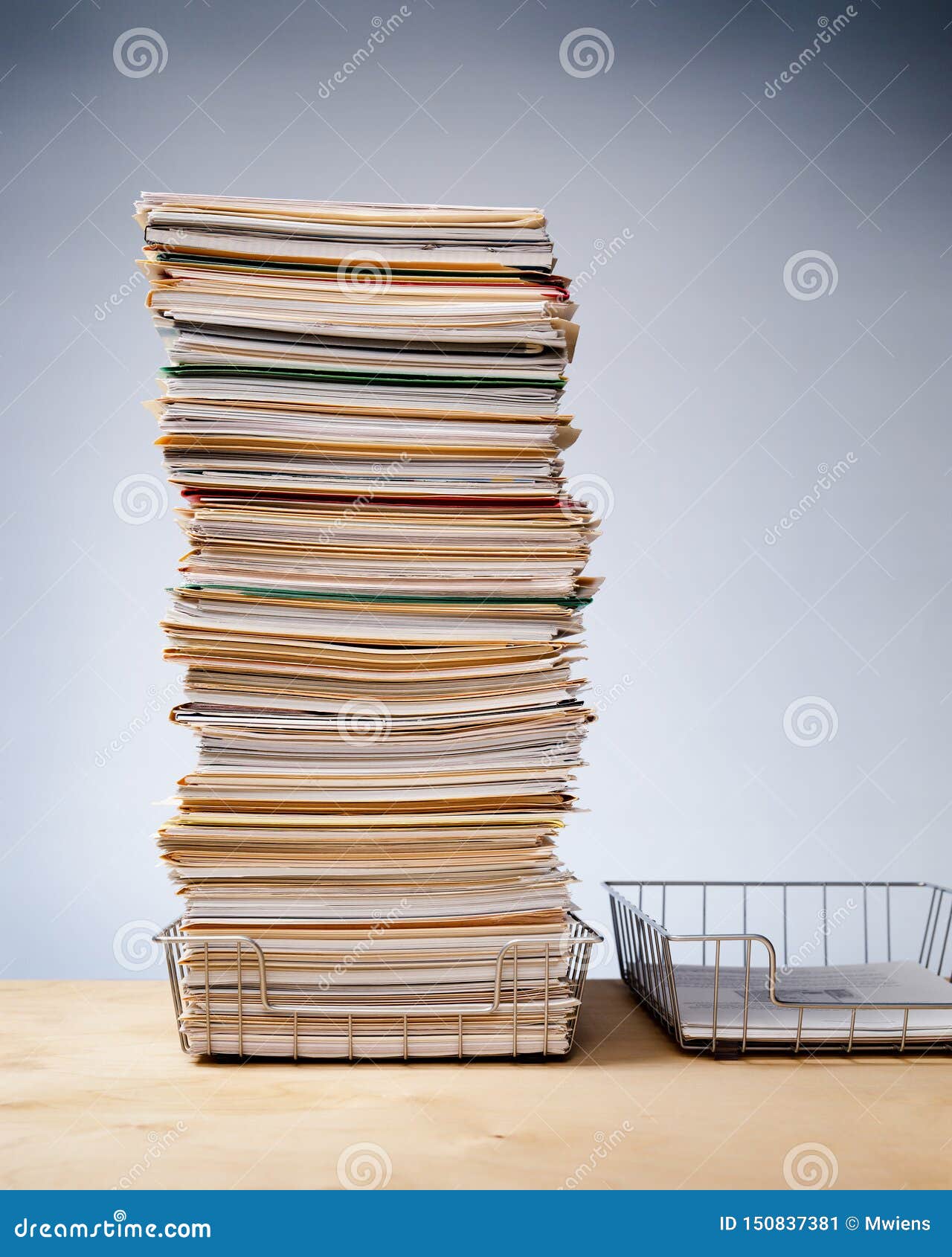 Trays on Desk with Ambitious Stack of Never Ending Pape Rwork Stock ...