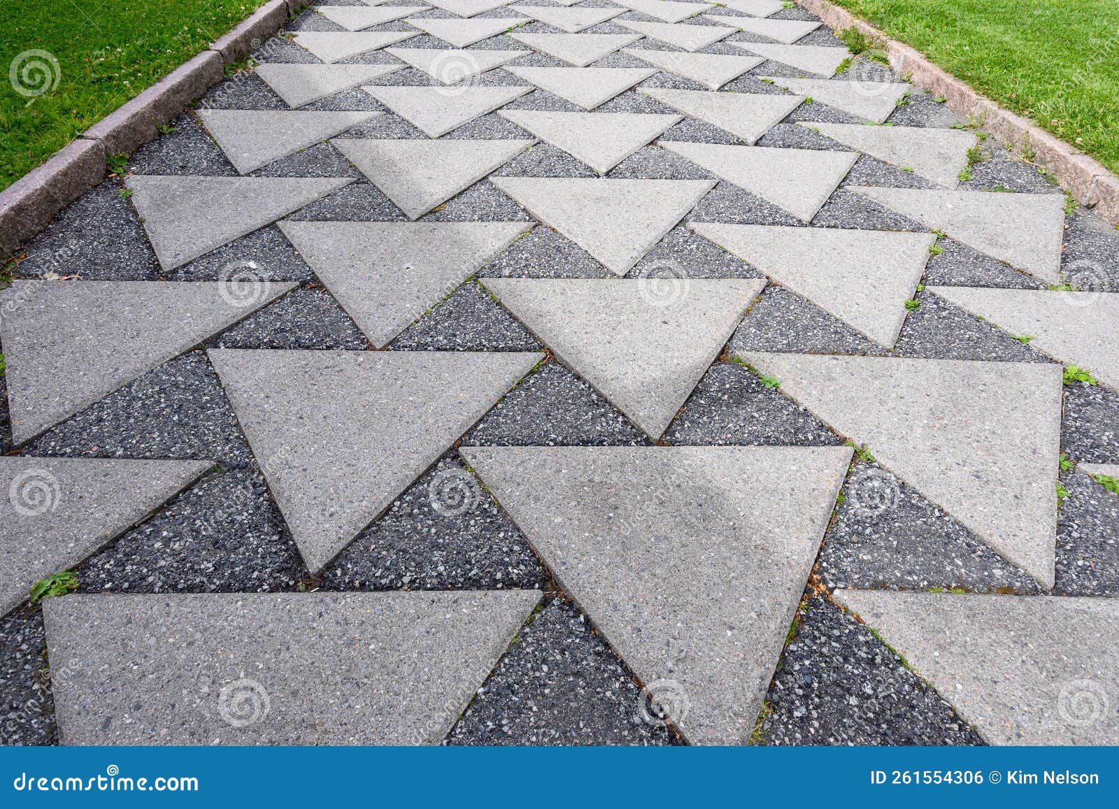 Outdoor Asphalt Patio with Triangular Shaped Concrete Inserts Stock ...