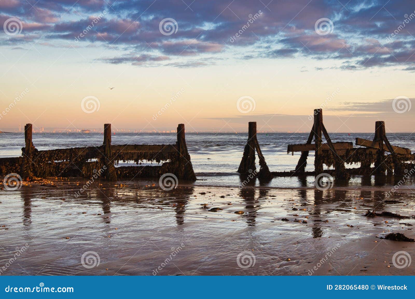 Outdoor Beach Scene Featuring Weathered Wooden Structures Against a ...