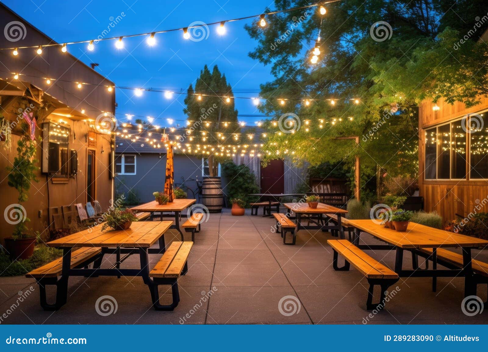 Outdoor Brewery Patio with String Lights and Picnic Tables Stock Photo ...