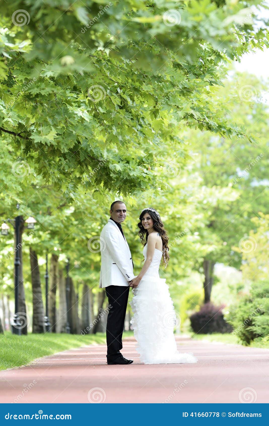 Outdoor Bride and groom stock photo. Image of diamonds - 41660778