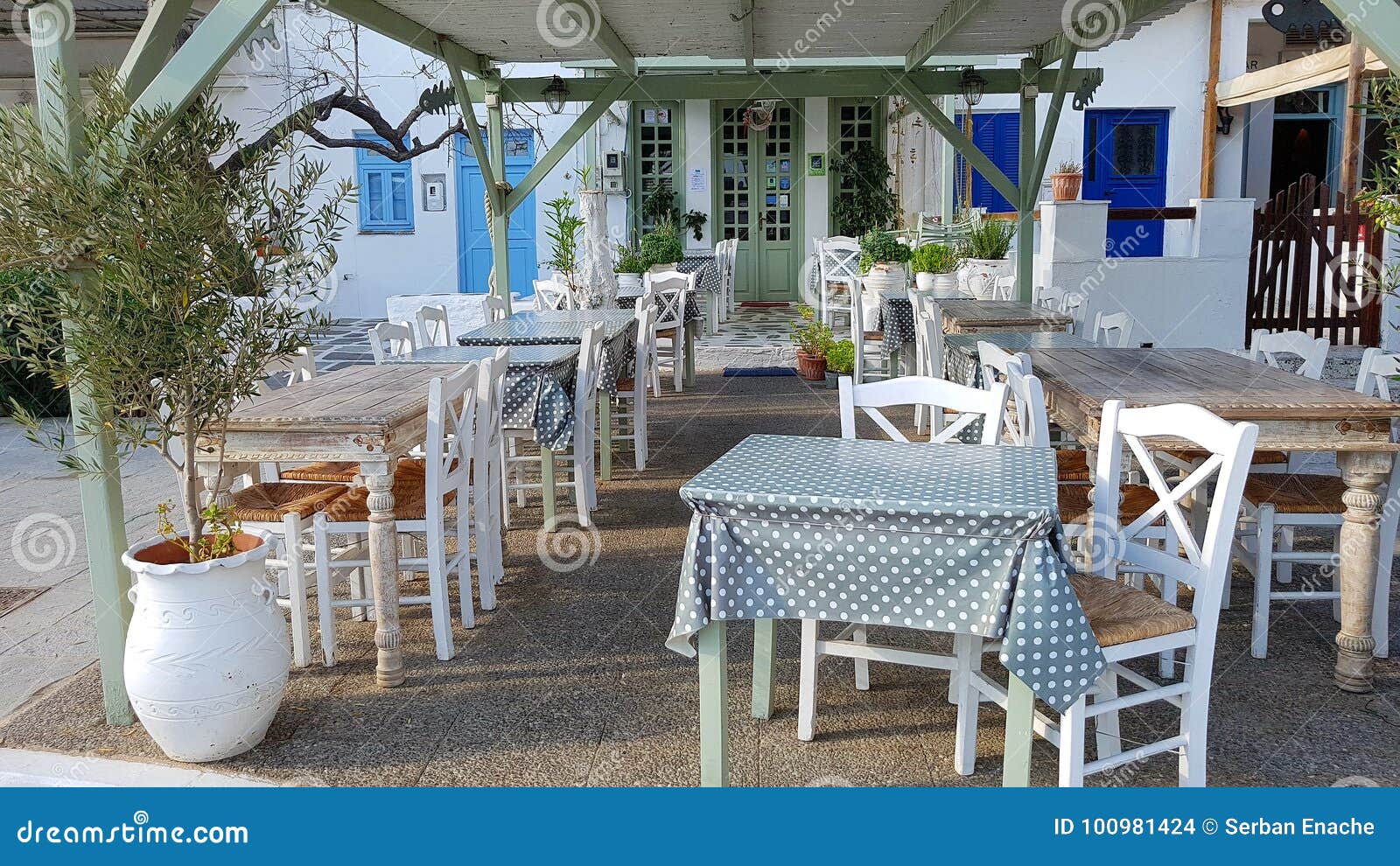 Outdoor cafe in Greece stock photo. Image of sunny, chair - 100981424