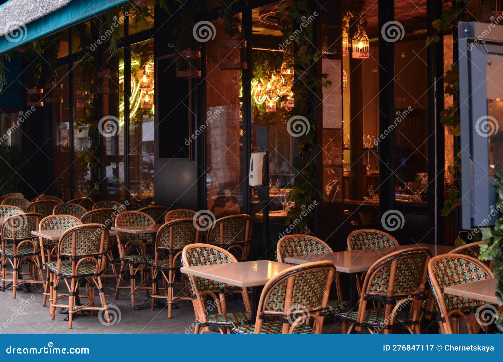 Outdoor Cafe with Rattan Chairs and Tables Stock Image - Image of city ...