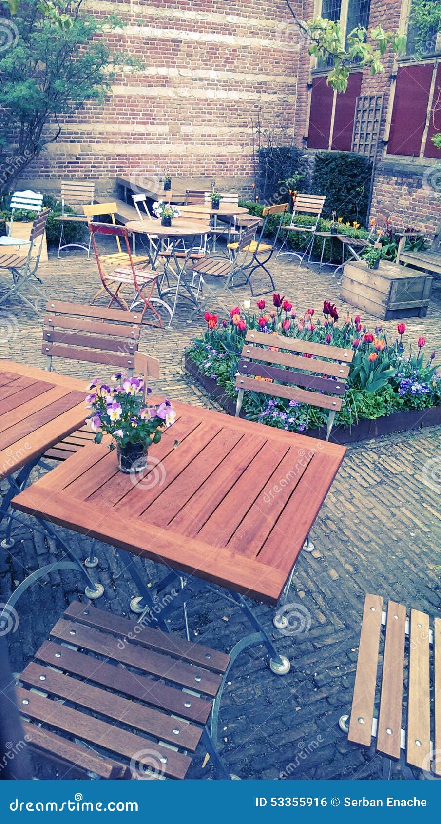 Outdoor Courtyard With Sidewalks And Gravel And Outdoor Table And ...