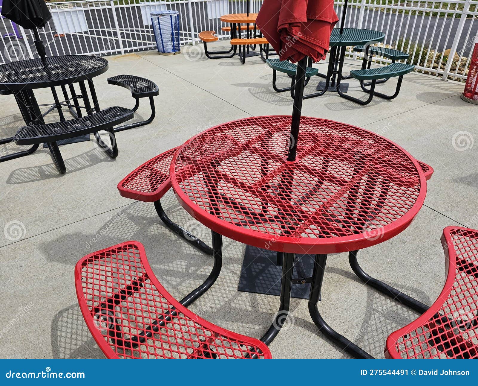 Outdoor Dining Area with Multi Colored Metal Dining Tables Stock Image ...