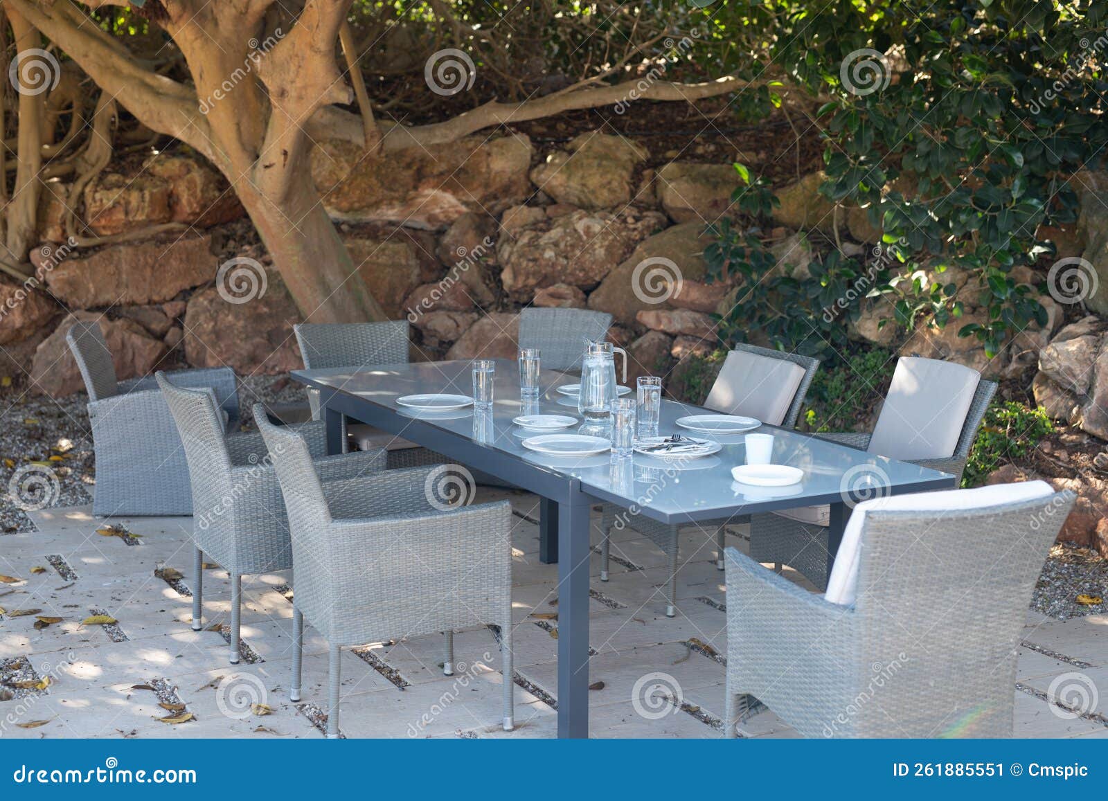 Outdoor Dining Area Under the Shelter of a Large Tree Stock Image ...