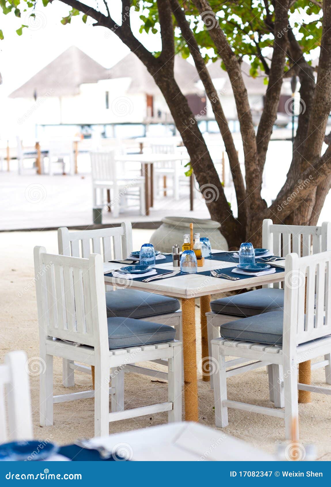Outdoor Dining Tables on the Sand Beach Stock Image - Image of ...
