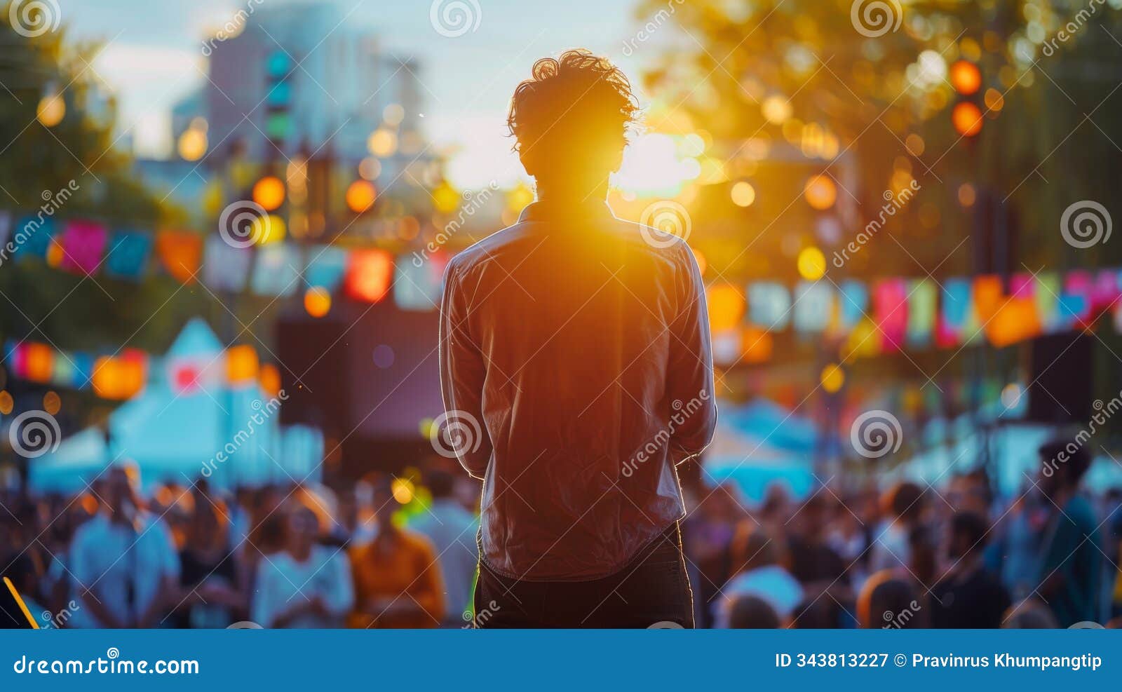 Outdoor Event with a Speaker on Stage Making a Special Announcement ...