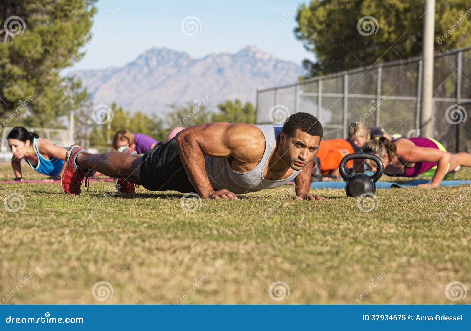 Outdoor Exercise Bootcamp stock image. Image of instructor - 37934675