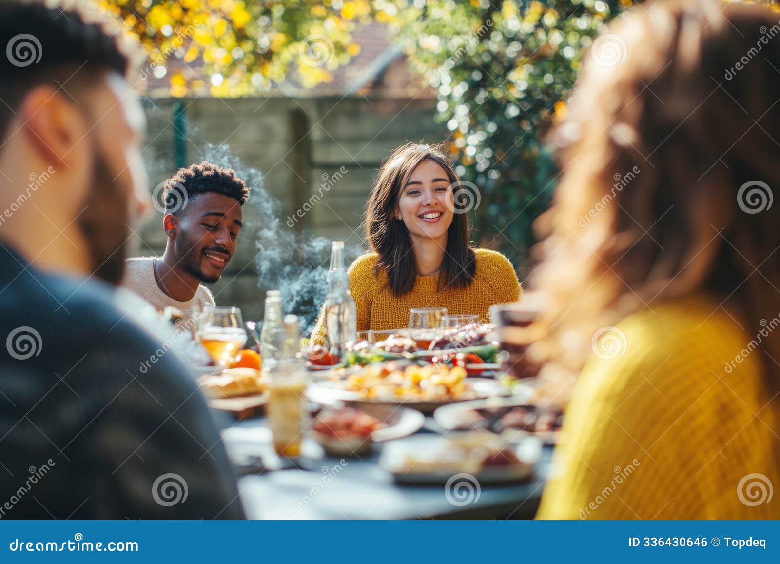 Outdoor Gathering with People Having a Meal in Autumn Setting Stock ...