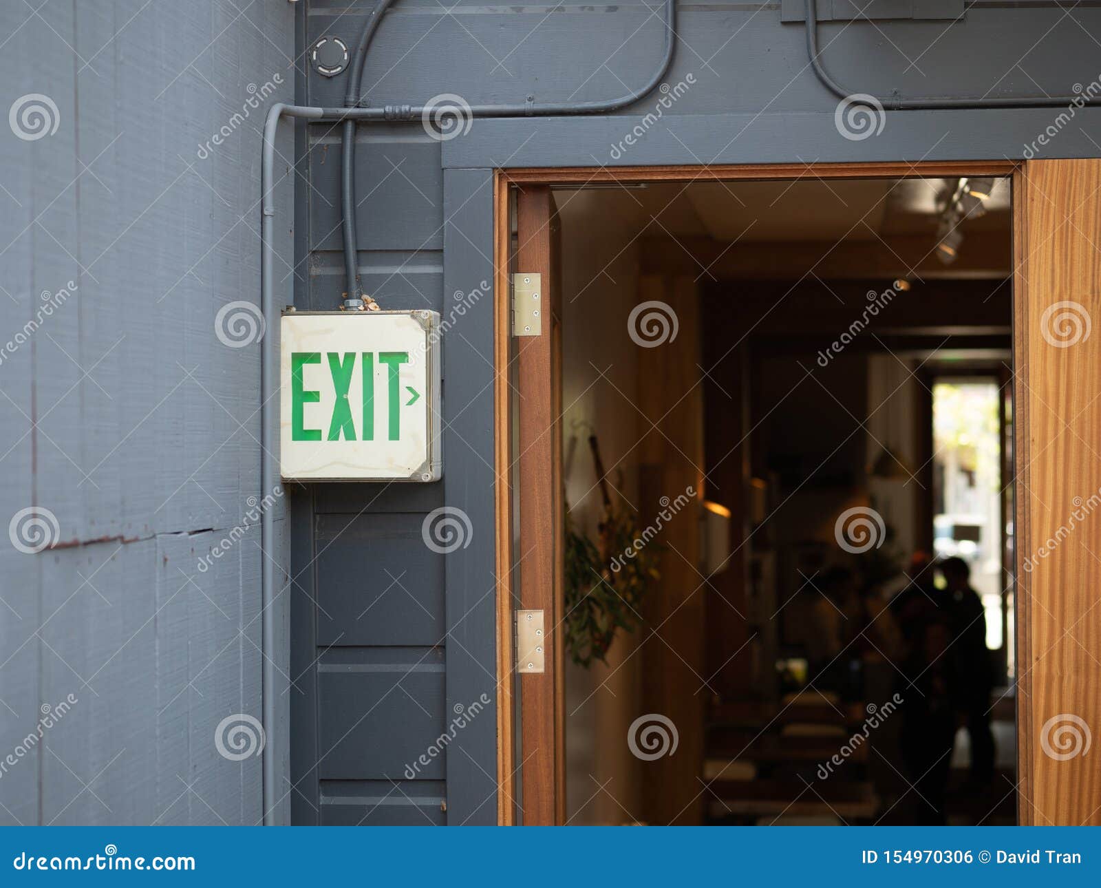 Outdoor Green Exit Sign Leading To Inside Building Restaurant Stock ...