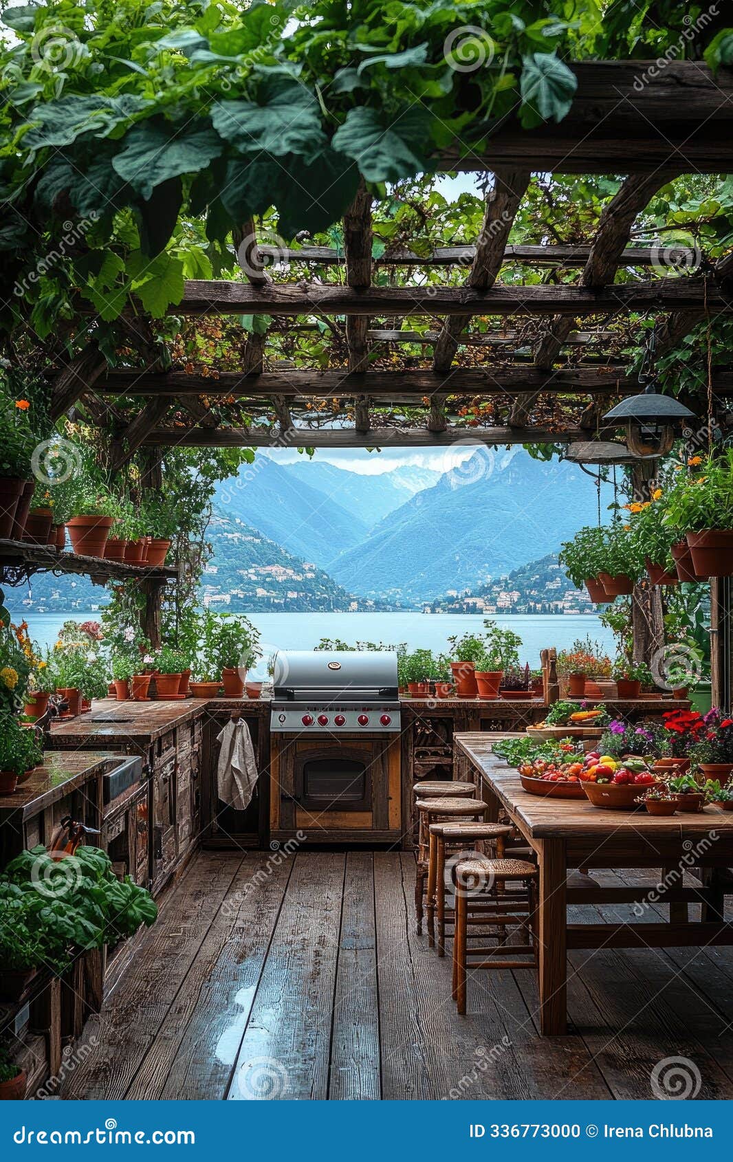 Outdoor Kitchen Overlooking a Lake Surrounded by Mountains Stock ...