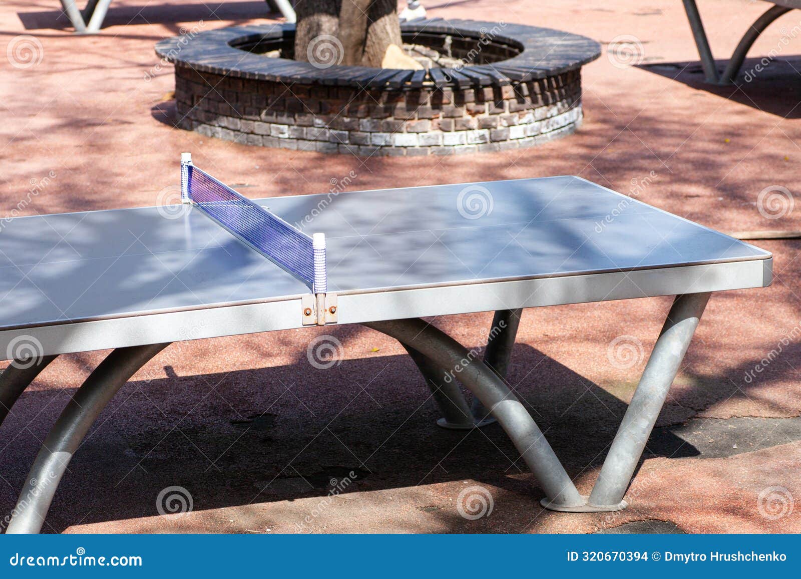 Outdoor Ping Pong Table in a Sunny Park Setting, Ready for a Game ...
