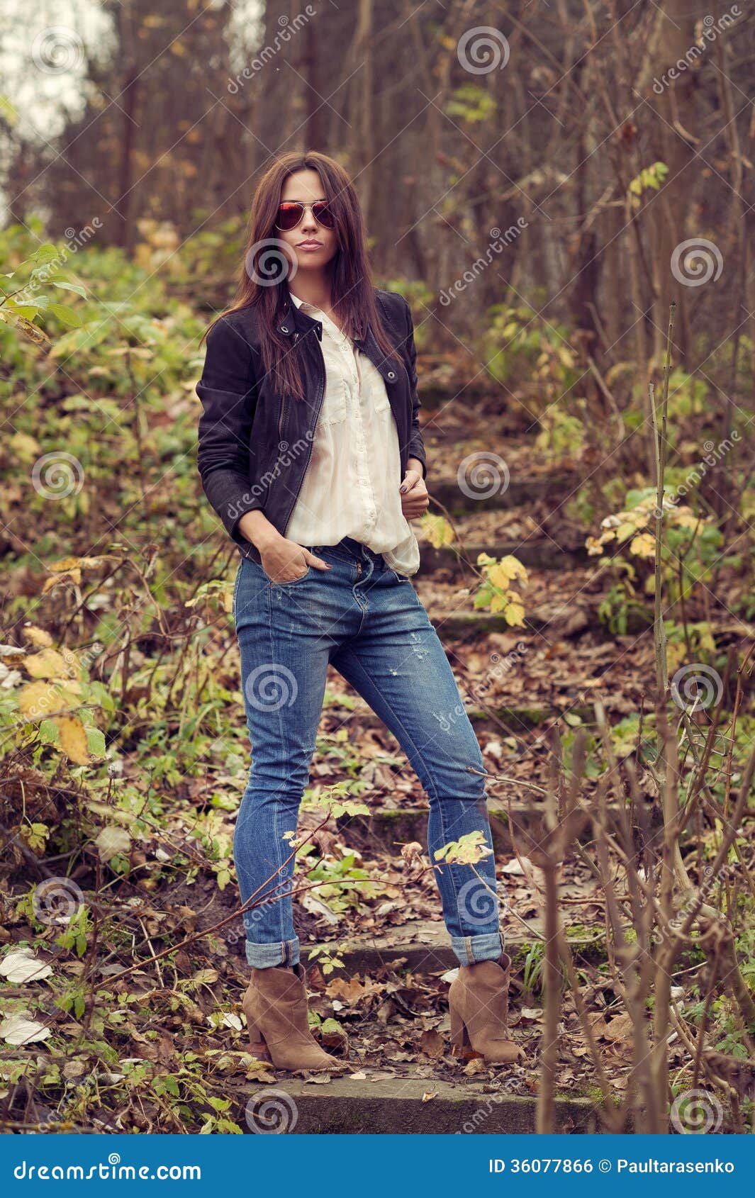 Outdoor Portrait Of Beautiful Female Model Posing Wearing Sunglasses