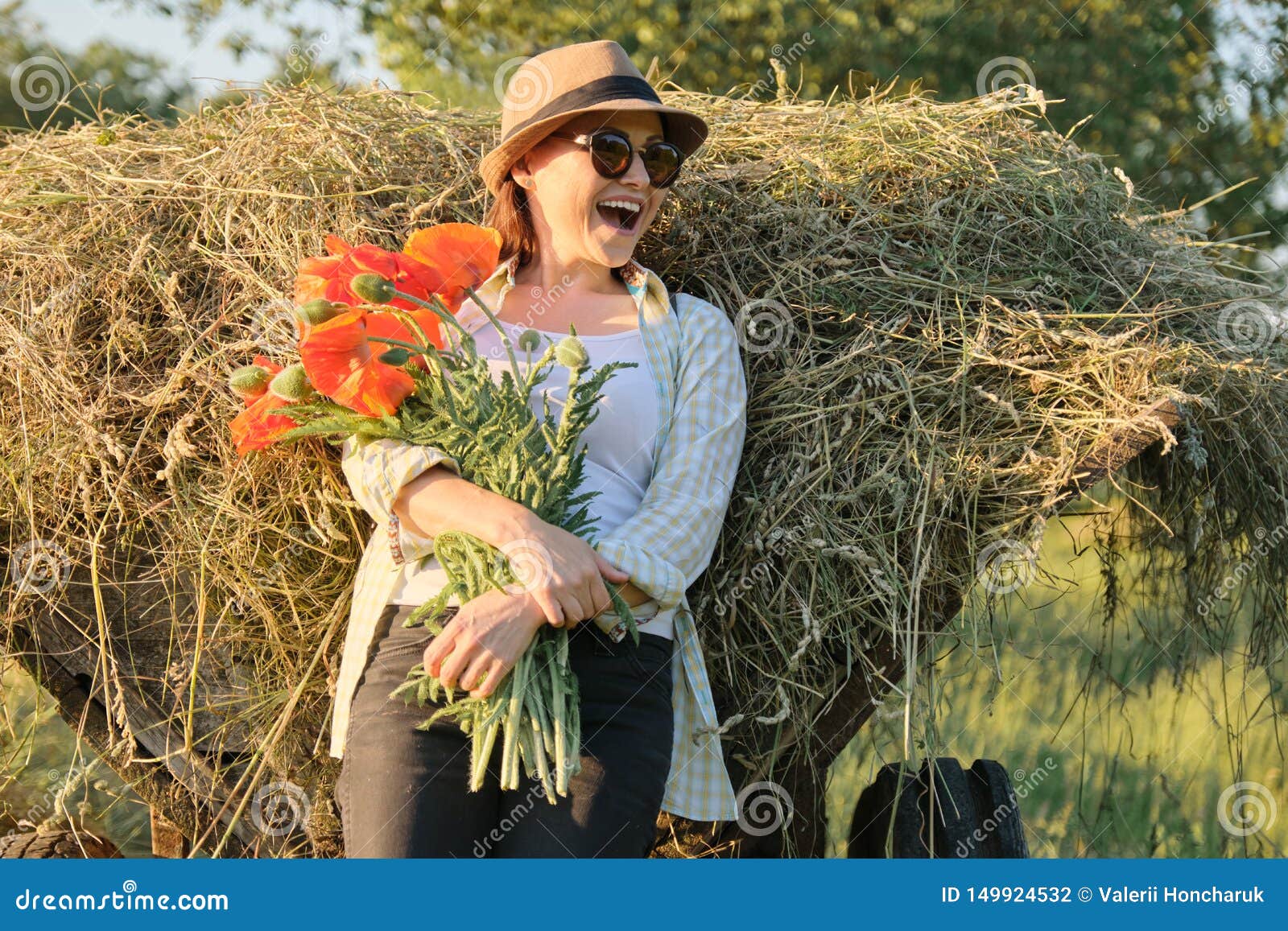 Outdoor Portrait Of Happy Mature Woman With A Bouquet Of Poppies Red ... Outdoor Portrait Of Happy Mature Woman With A Bouquet Of Poppies Red ...