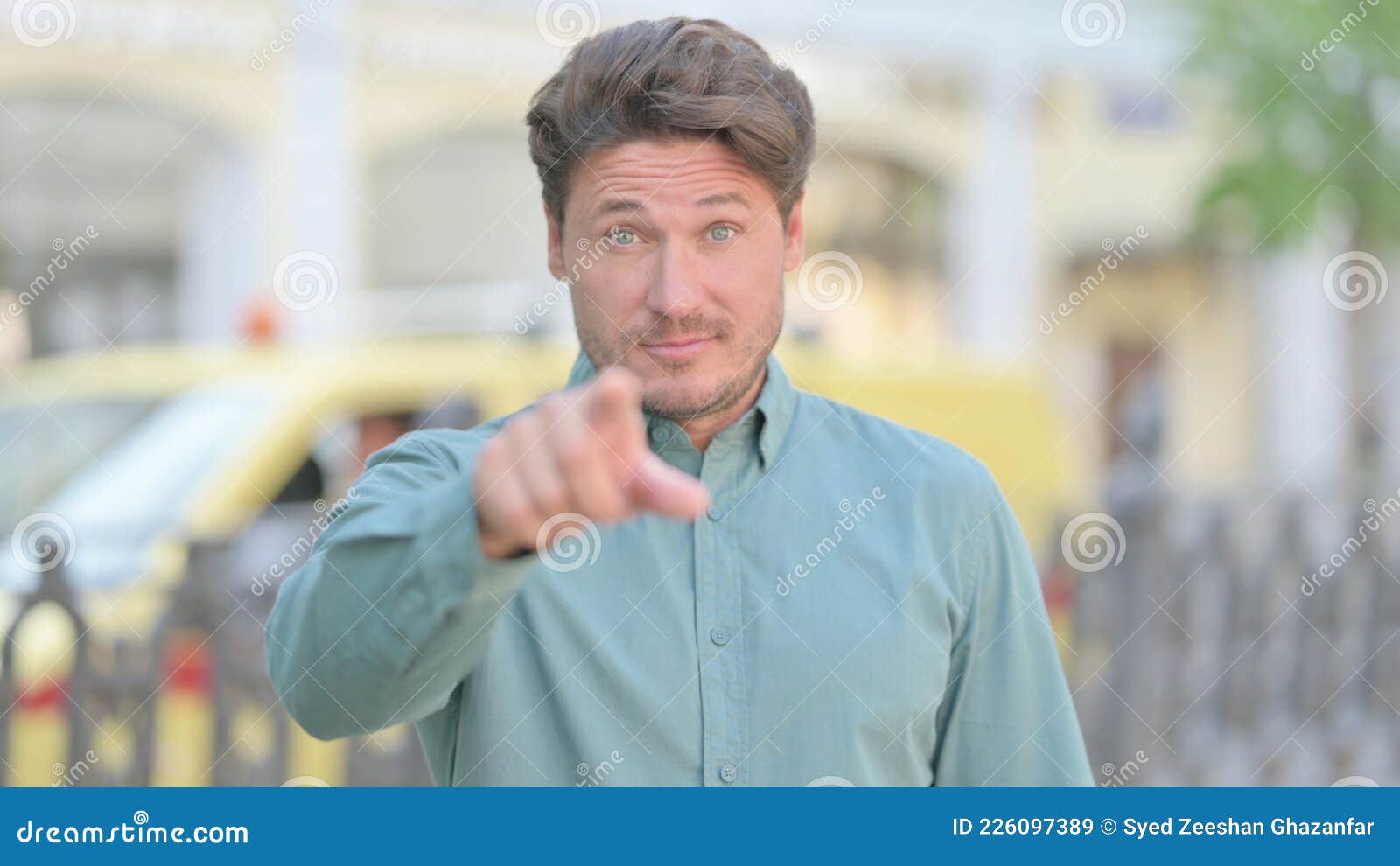 Outdoor Portrait of Man Pointing at the Camera and Inviting Stock Image ...