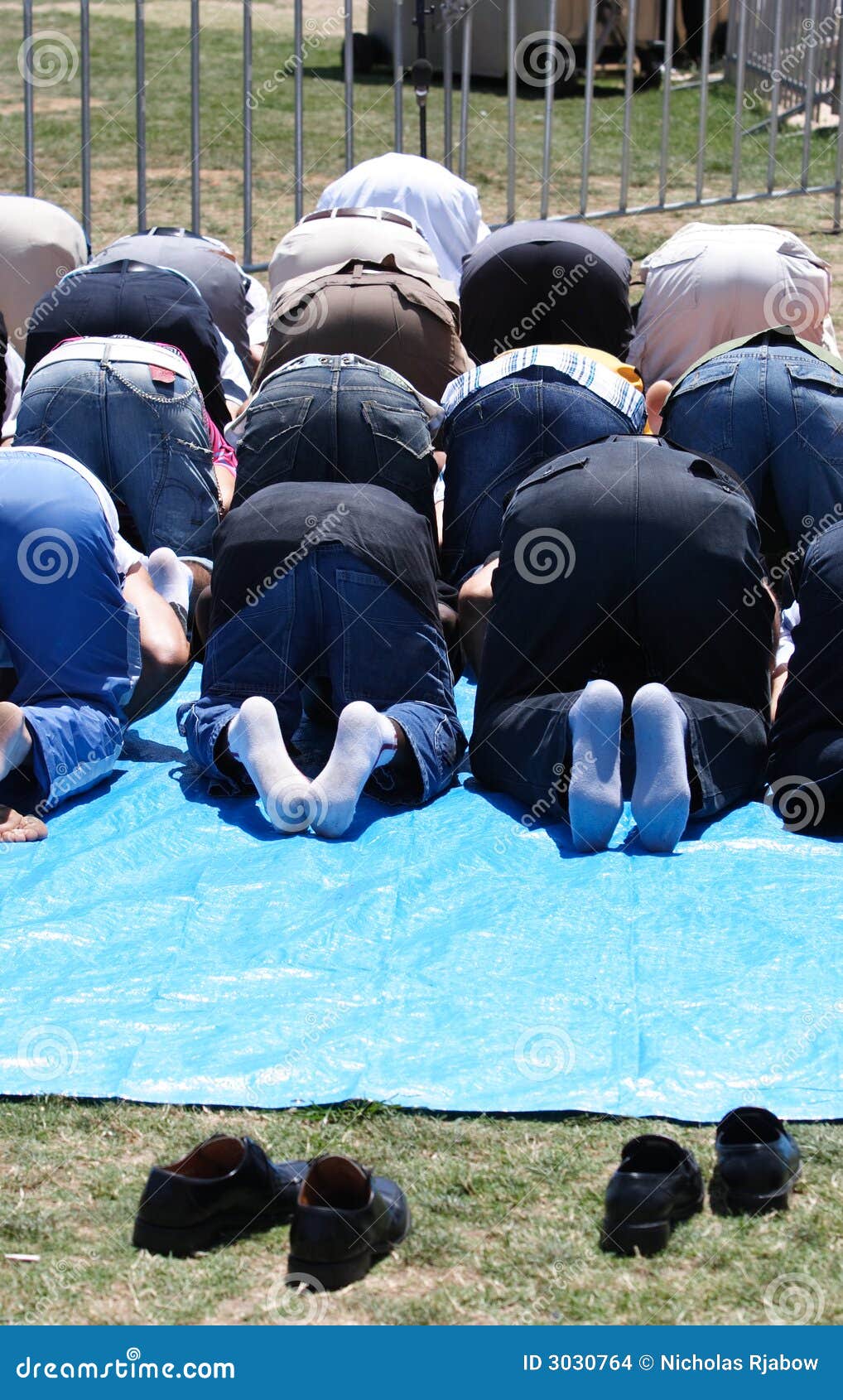 Outdoor Prayers stock photo. Image of backs, fence, shirts - 3030764