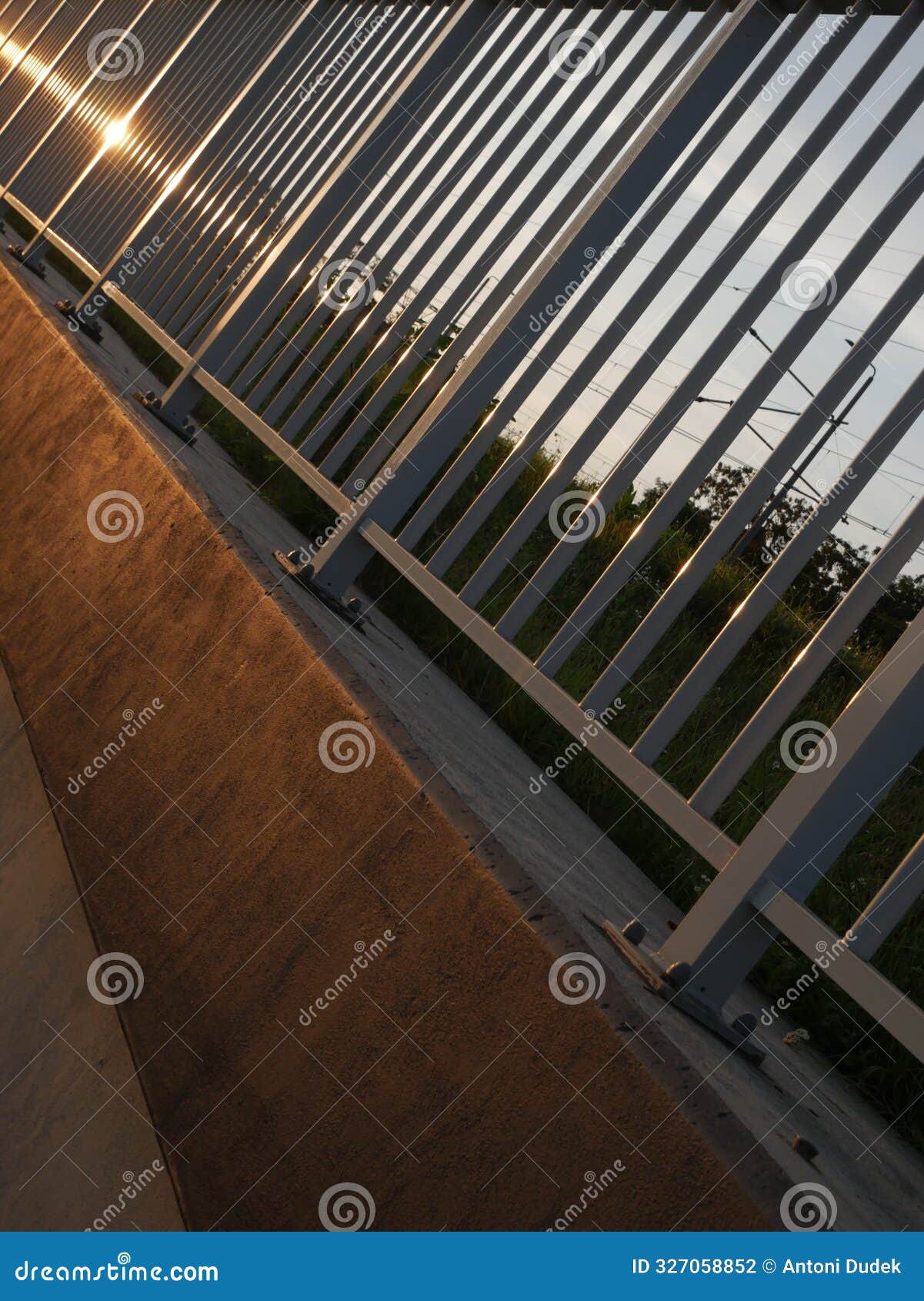 An Outdoor Railing at Sunset Stock Photo - Image of travel, horizon ...