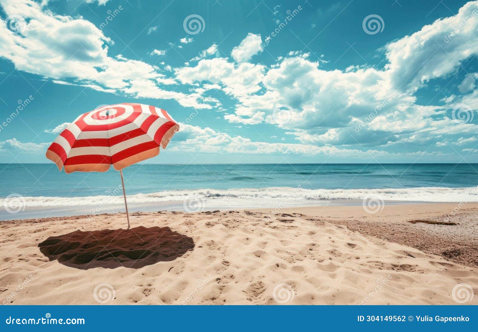 An Outdoor Red and White Striped Umbrella on a Beach Stock Photo ...