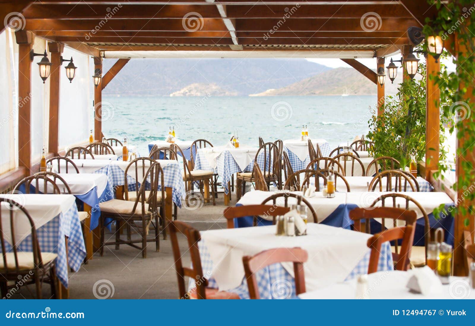 Outdoor Restaurant At The Beach. Cafe On The Beach, Ocean And Sky ...