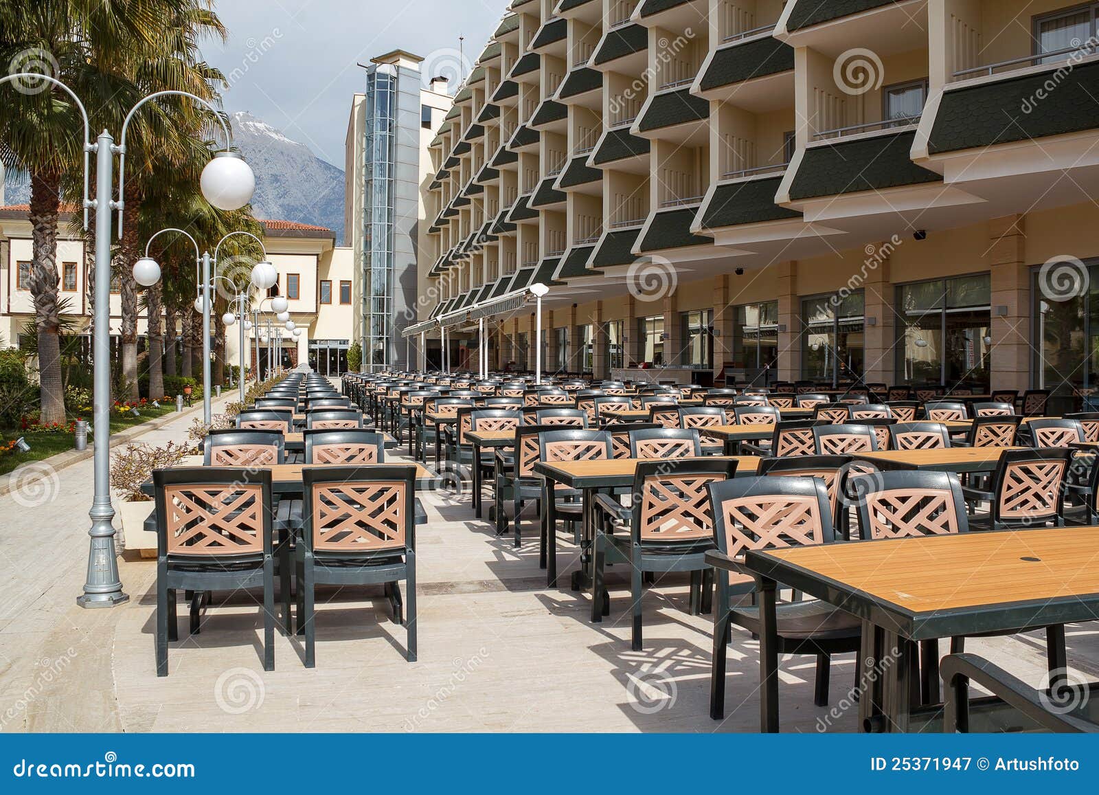 Outdoor Seating in Empty Hotel Stock Image - Image of palm, building ...