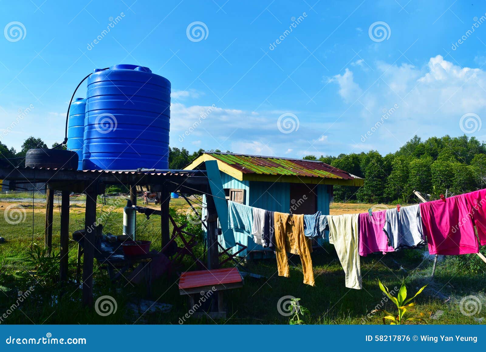 Outdoor Simple Blue Plastic Cistern and Hut and Clothes Drying Stock ...