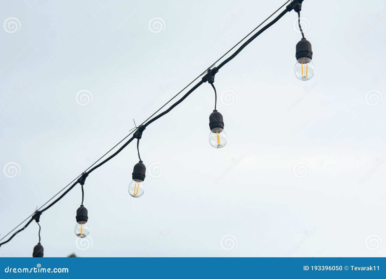 Outdoor String Light Bulbs Hanging on a Line Stock Photo - Image of ...