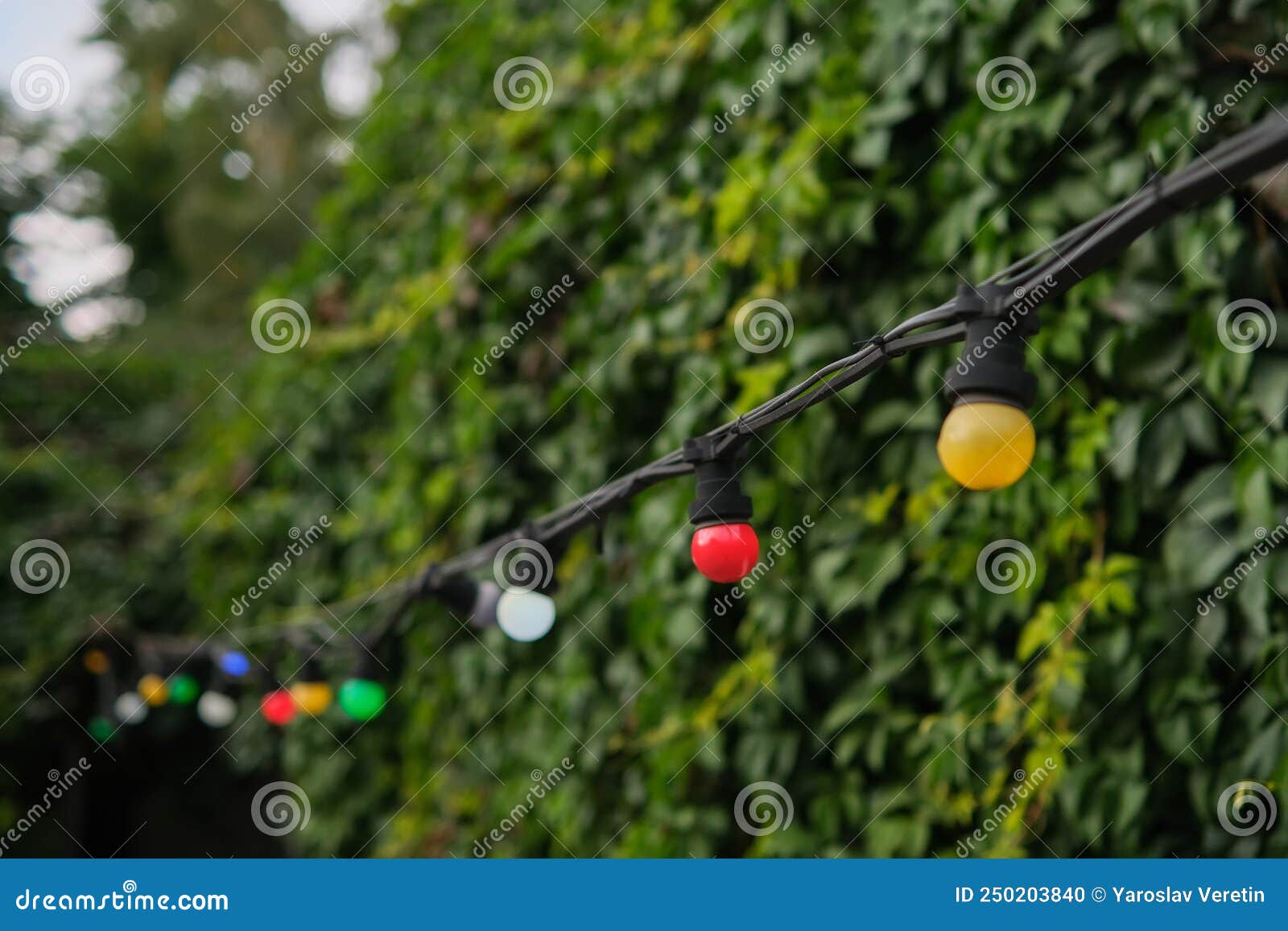 Outdoor String Lights Hanging on a Line in Small Town Stock Photo ...