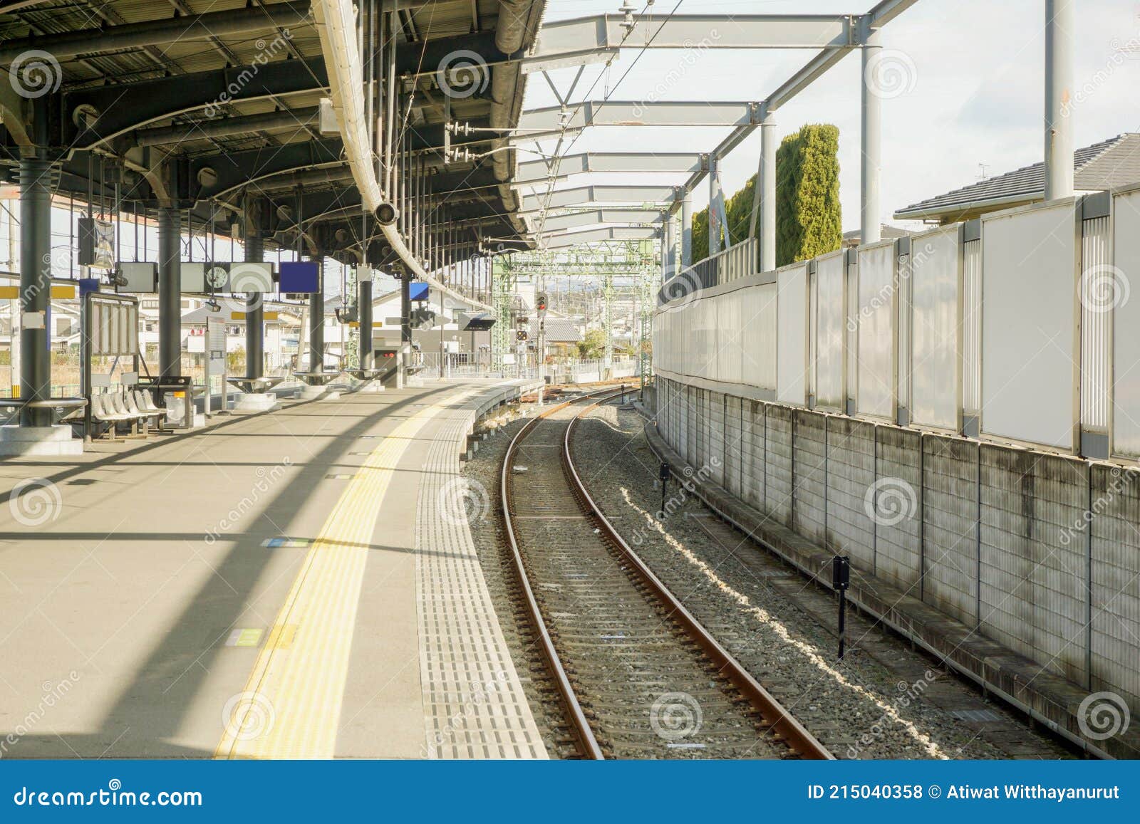 Outdoor Train Platform and Railroad Track on Sunny Day Stock Photo ...