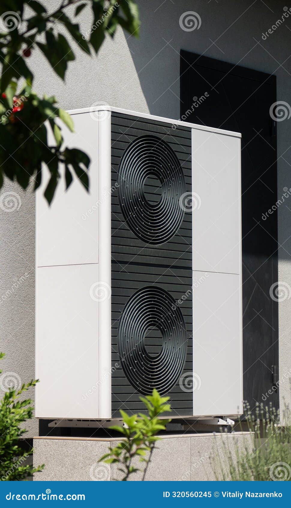 Outdoor Unit of a Heat Pump by the Wall of a House. Modern and Energy ...