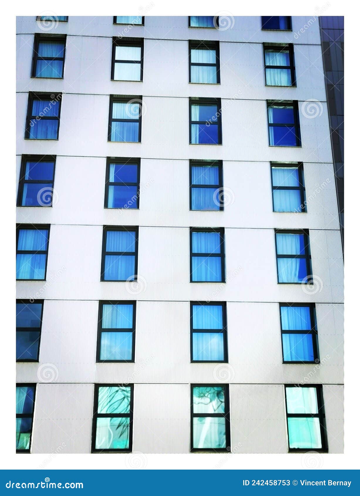 An Outdoor View of a Building with a Reflection on Windows Stock Image ...
