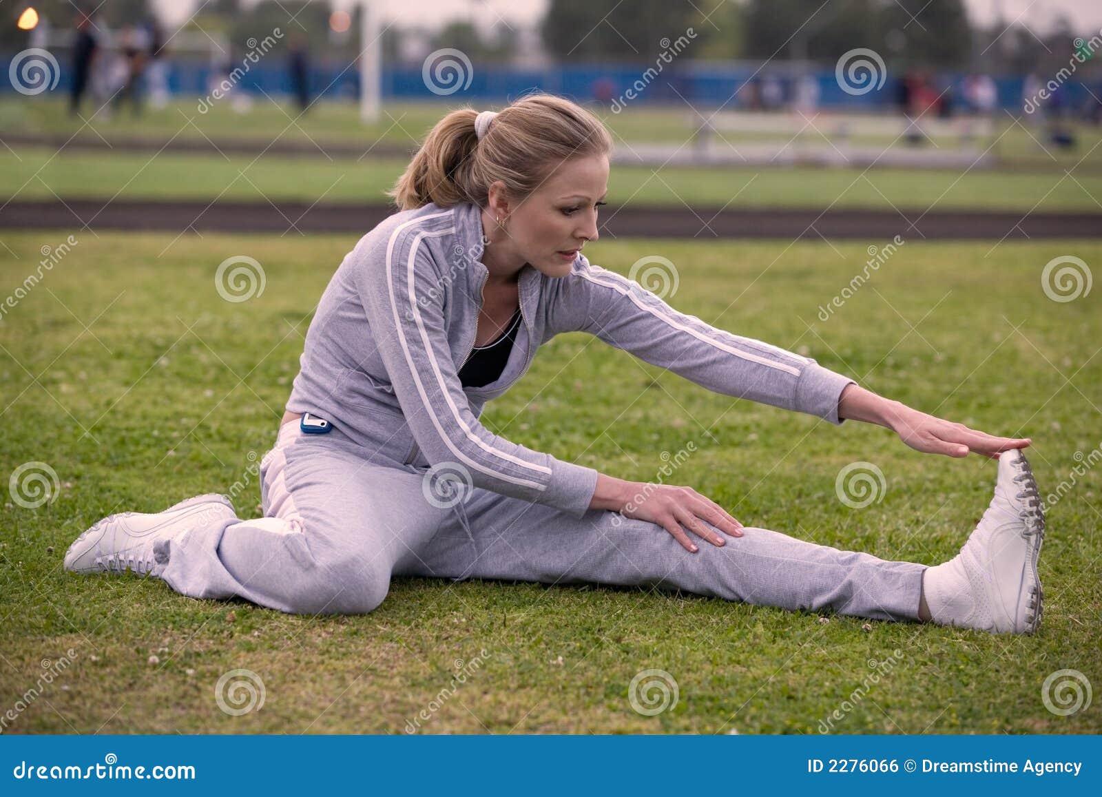 Outdoor warm-up stock photo. Image of sitting, blond, adult - 2276066