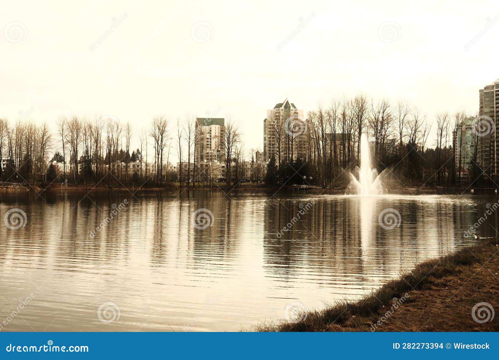 Outdoor Water Feature in a Lake Setting with a Cityscape Visible in the ...
