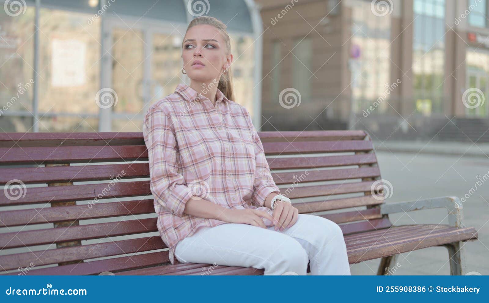 Outdoor Young Man Checking Time while Waiting on Bench Stock Photo ...