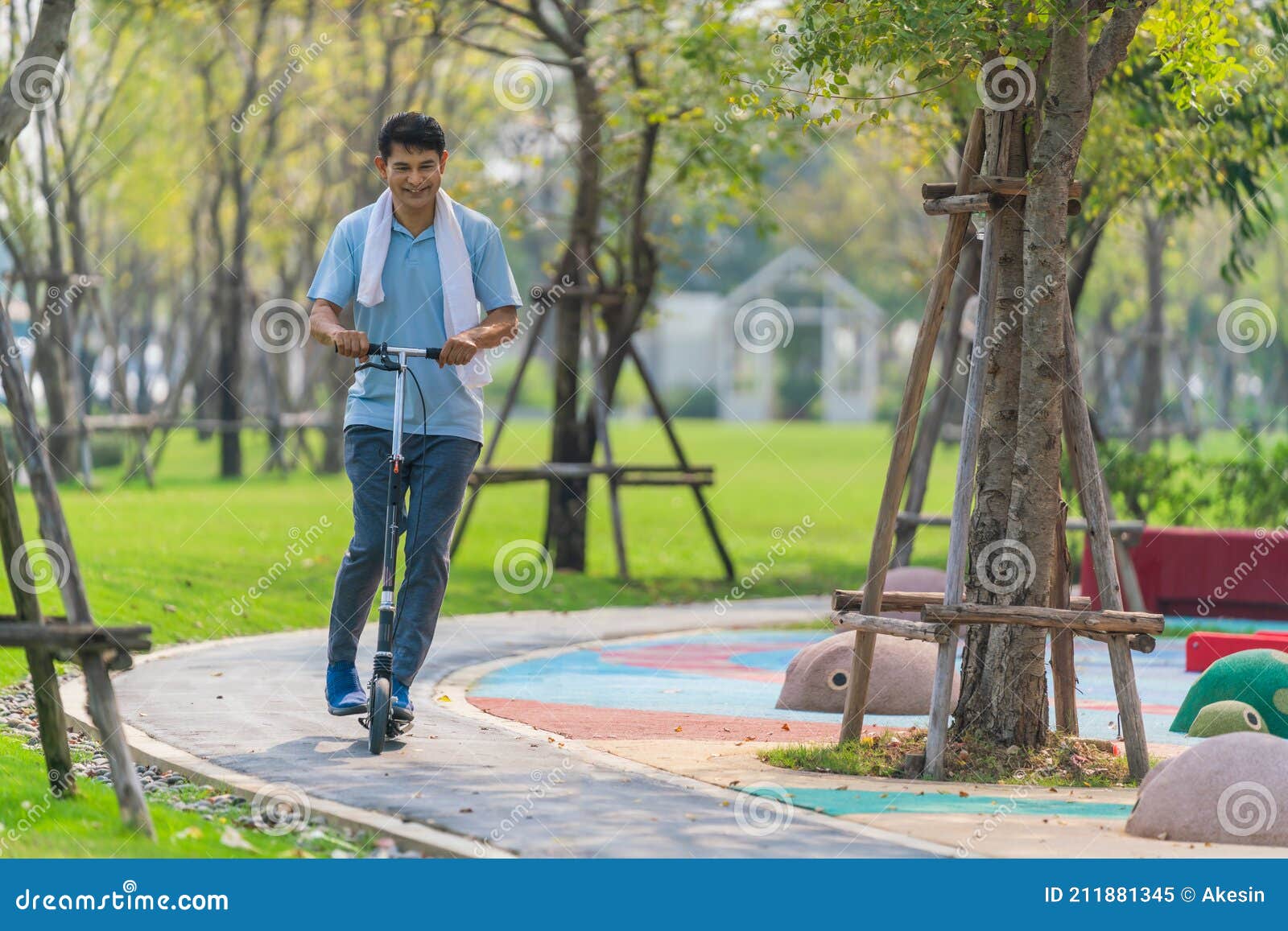 Outdoors Exercise Background of Man Ridding on Kick Scooter on Pavement ...