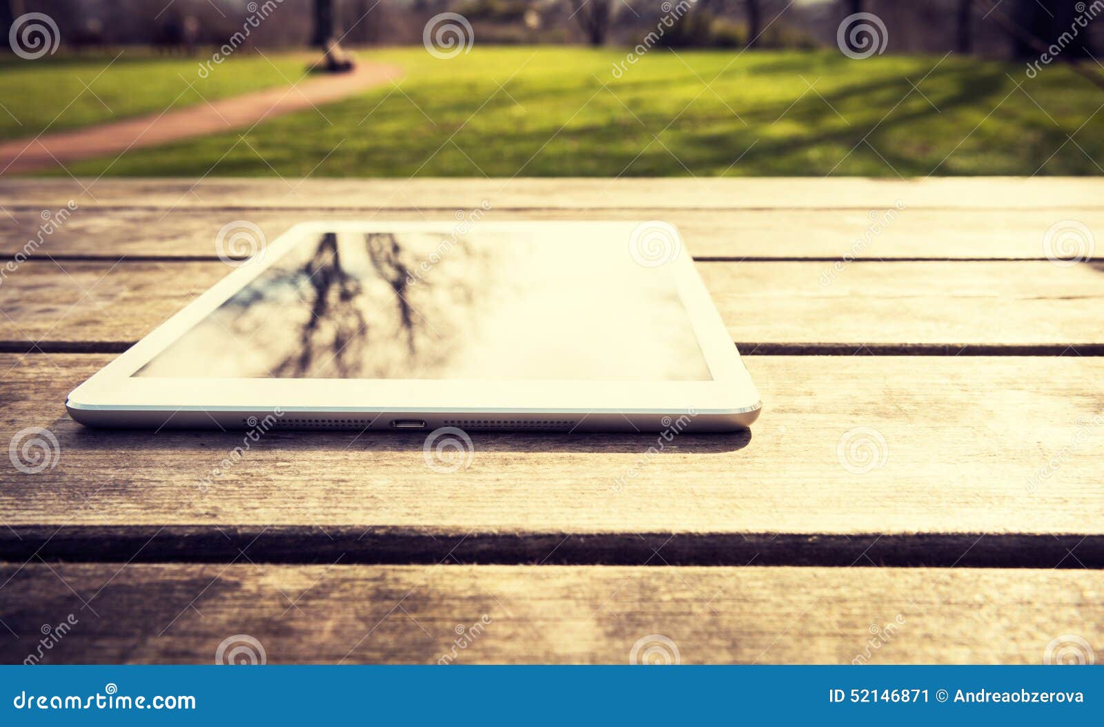 Outdoors Rustic Wooden Table with Digital Tablet, Reflecting Trees ...