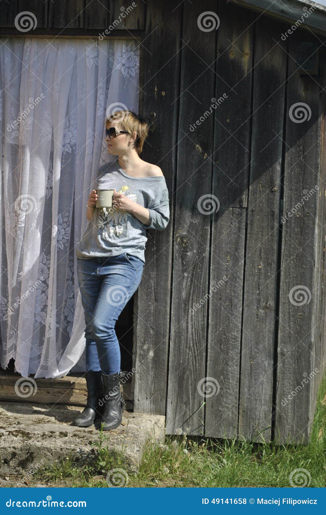 Young Short Hair Woman Standing on the Threshold of a House Stock Photo ...