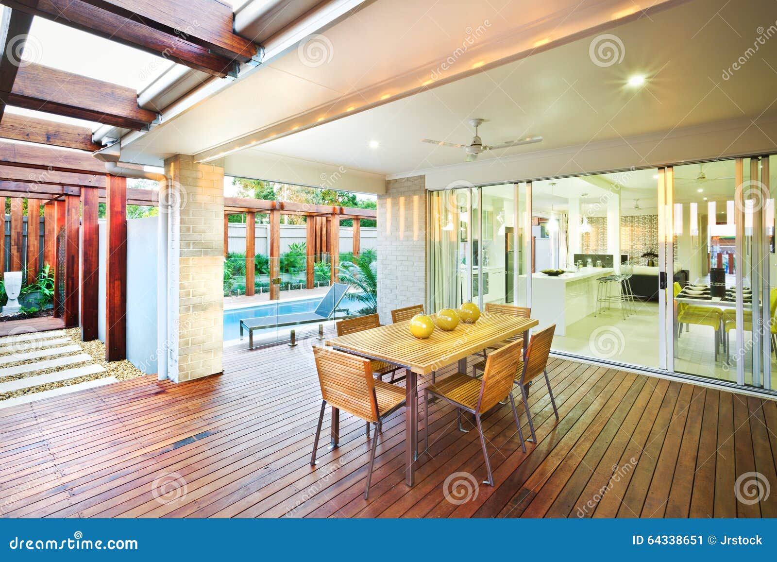 A Outside View of House with Dining Table and Attached Rooms Stock ...