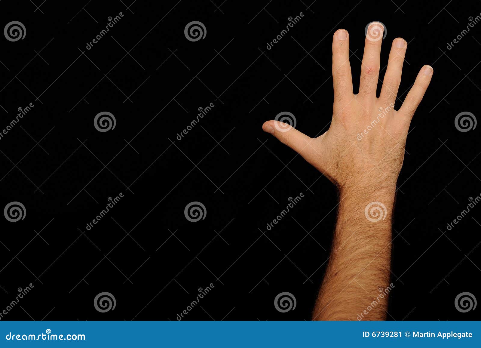 The Outstretched Hand Of A Businessman Points To A Pyramid Of Wooden ...