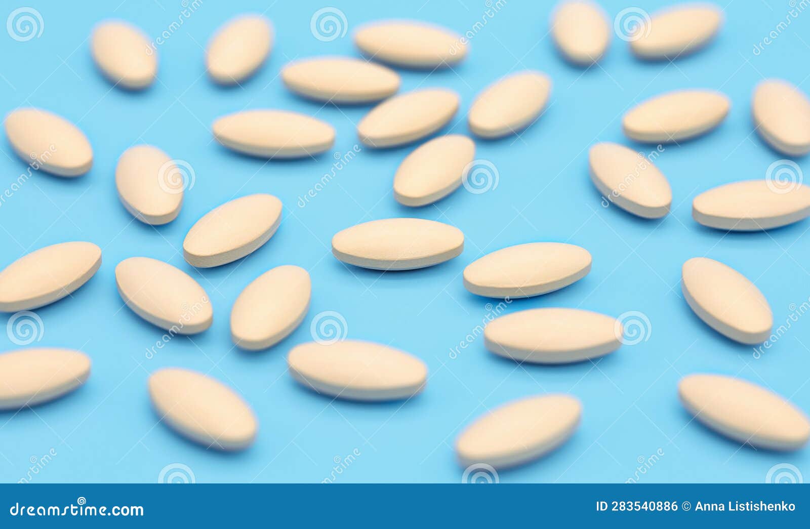 Oval-shaped Tablets Lie on Contrasting Background Stock Photo - Image ...