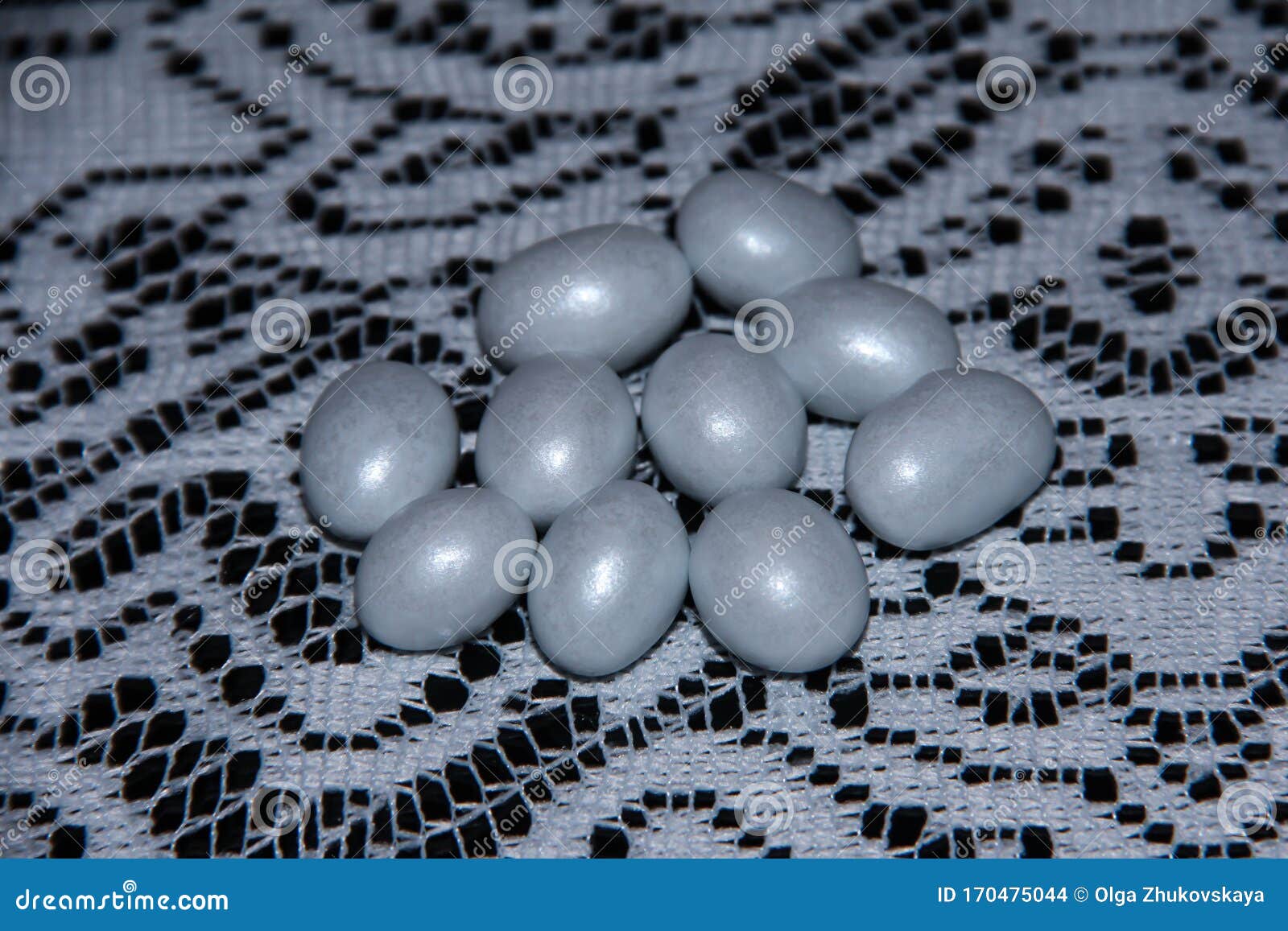 Oval Silver Candies on a Lace Tablecloth Stock Photo - Image of ...
