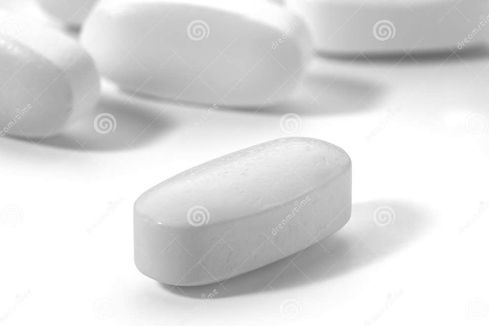 Oval Tablet Close-up on a White Stock Image - Image of tablet, oral ...