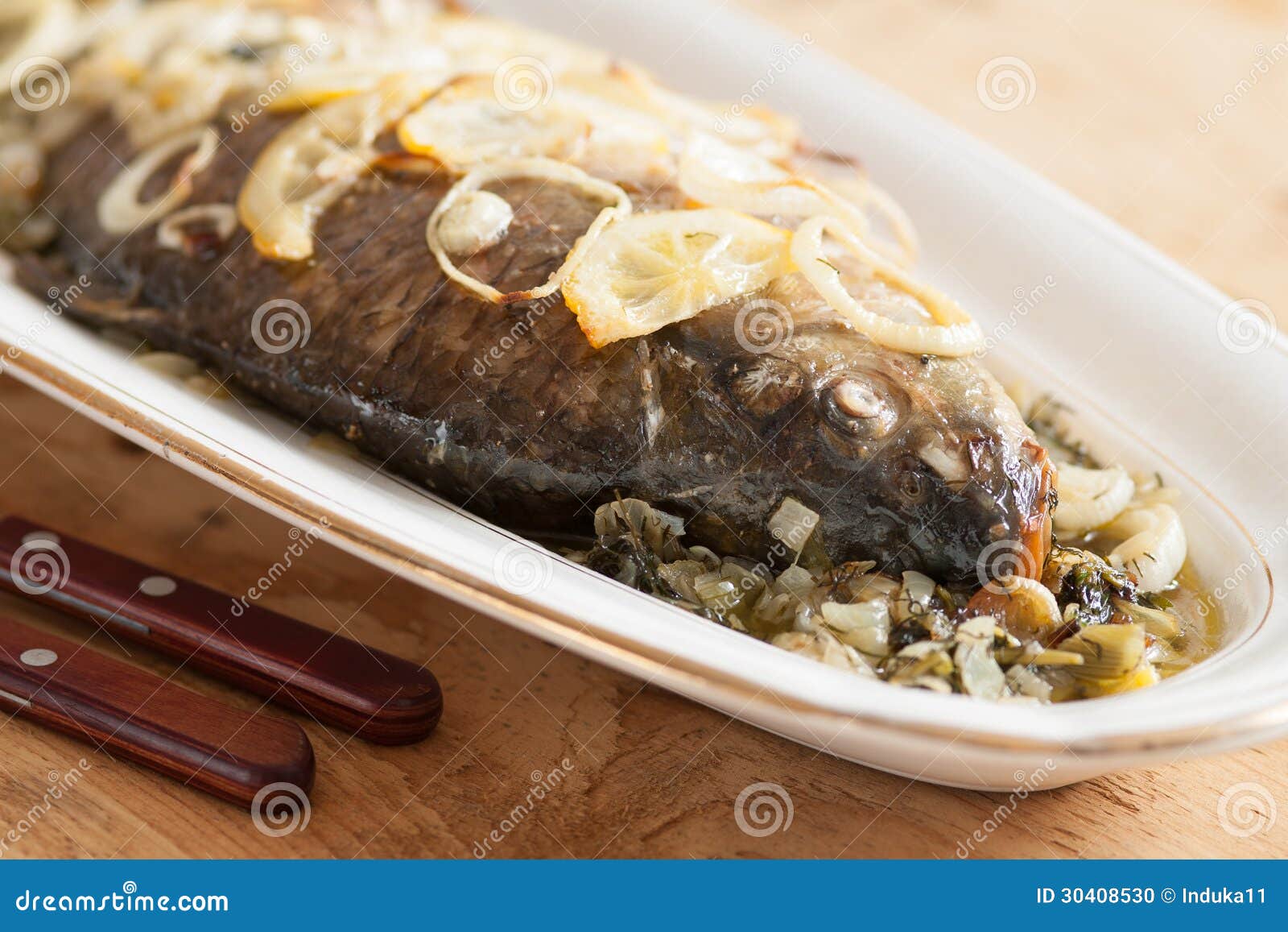 Oven baked carp fish stock photo. Image of herb, slice - 30408530