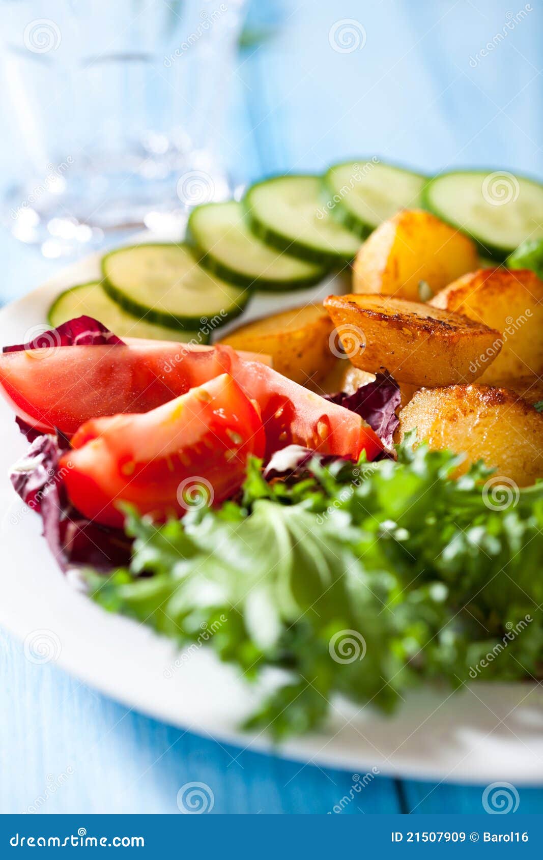 Oven Baked Potatoes with Fresh Vegetables on a Pla Stock Image - Image ...
